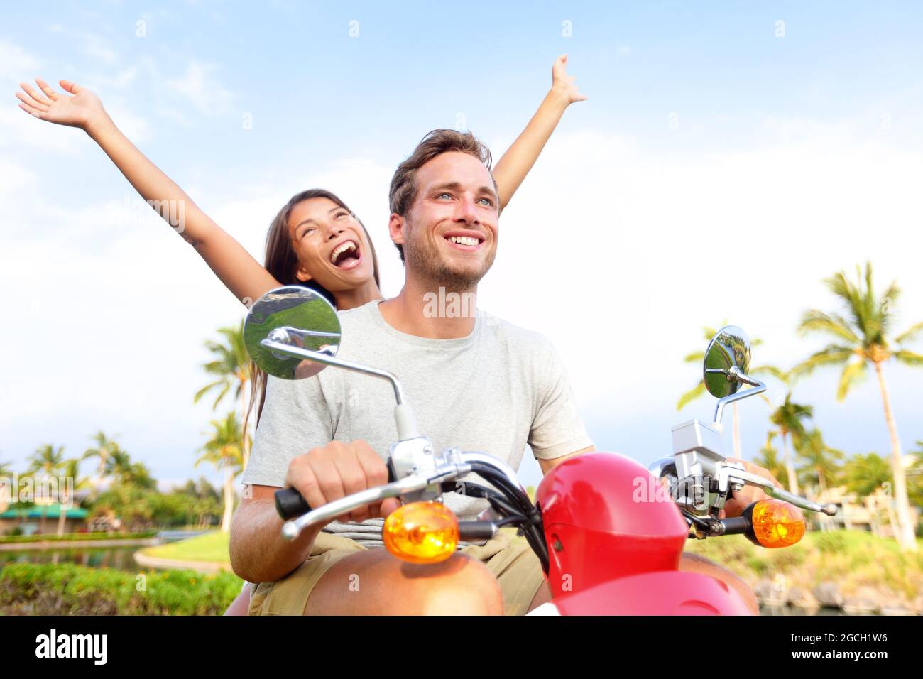 Road trip summer fun happy couple enjoying ride. Cheerful Asian woman ...