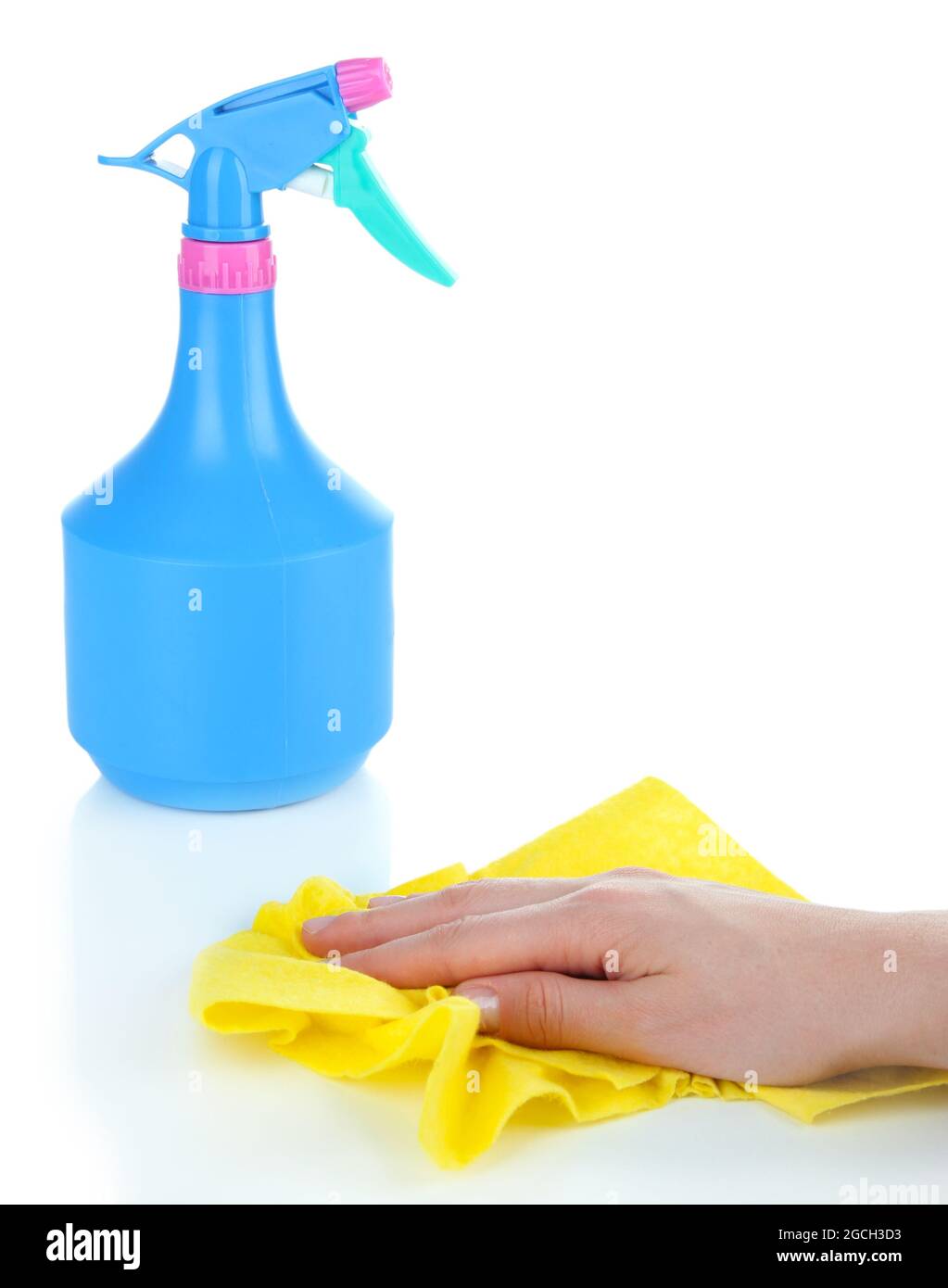 Hand wiping surface with yellow rag and spray isolated on white Stock ...
