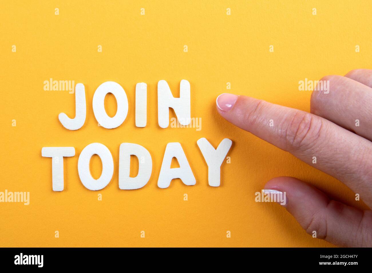 Join Today. Business concept. White letters and a woman's hand on a ...
