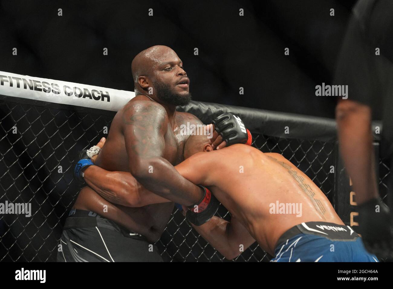 (L-R) Derrick Lewis grapes with Ciryl Gane in their Interim Heavyweight ...