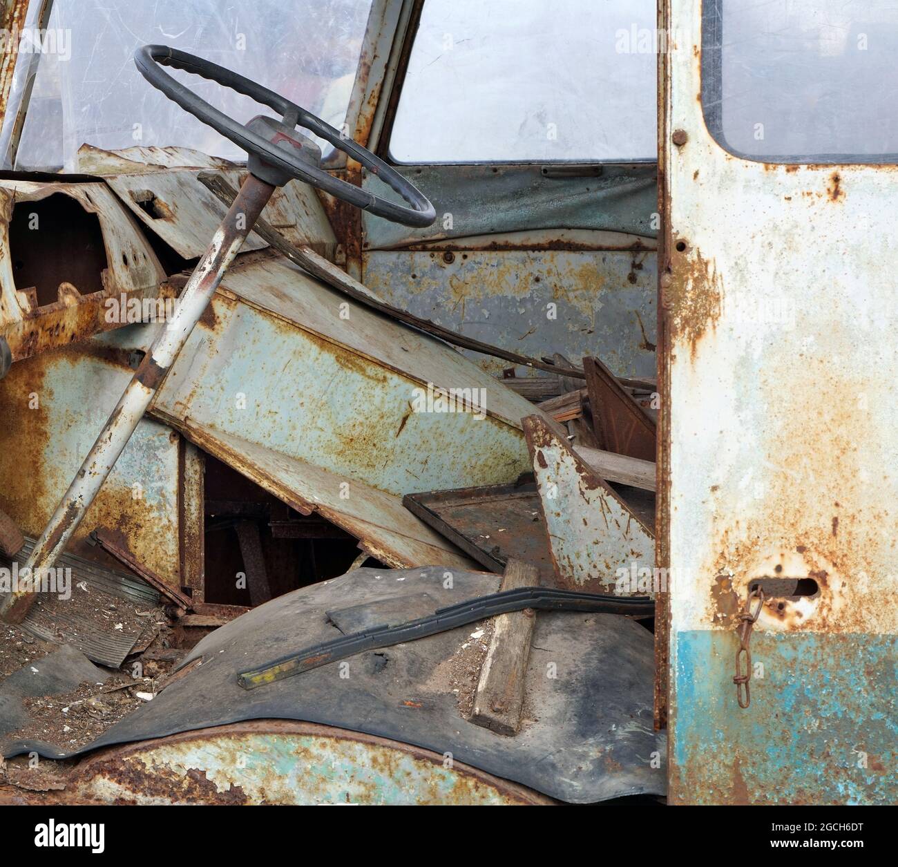 Steering wheel inside the ruined cabin of an old broken bus Stock Photo ...