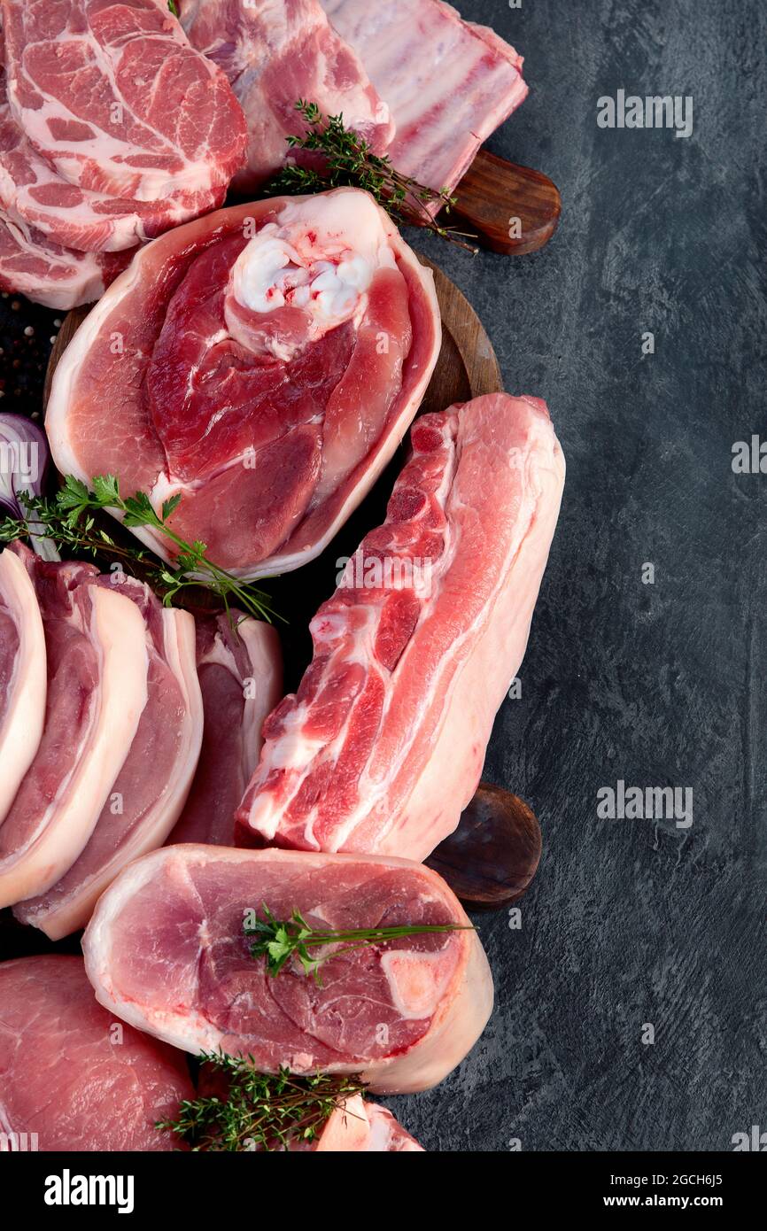 Different types of raw meat on black background. Foods high in protein ...