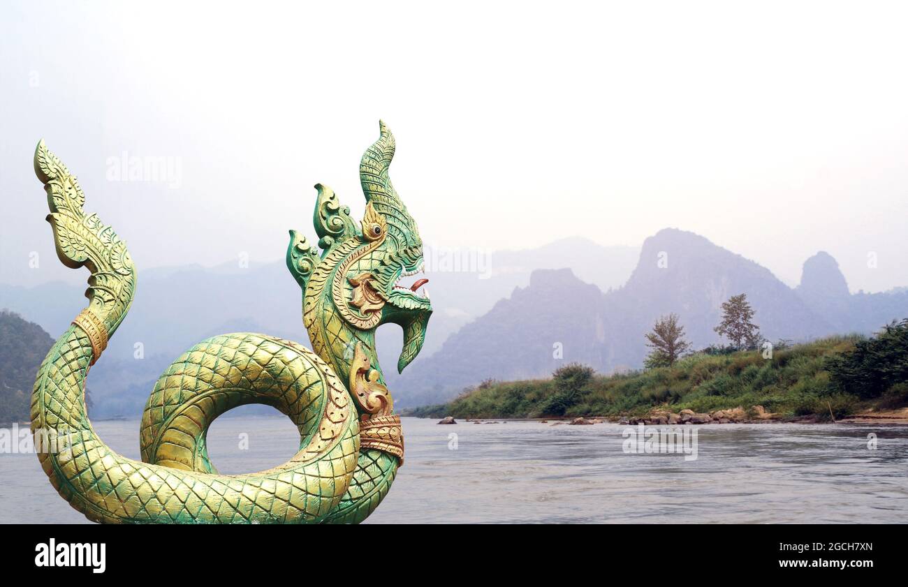 Ancient statue of mythical asian naga snake and beautiful morning ...