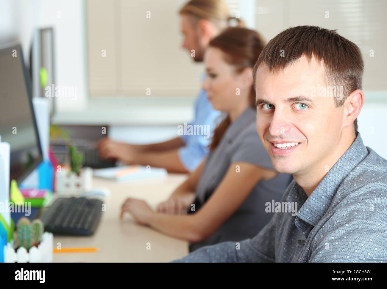 Business people at work place Stock Photo - Alamy