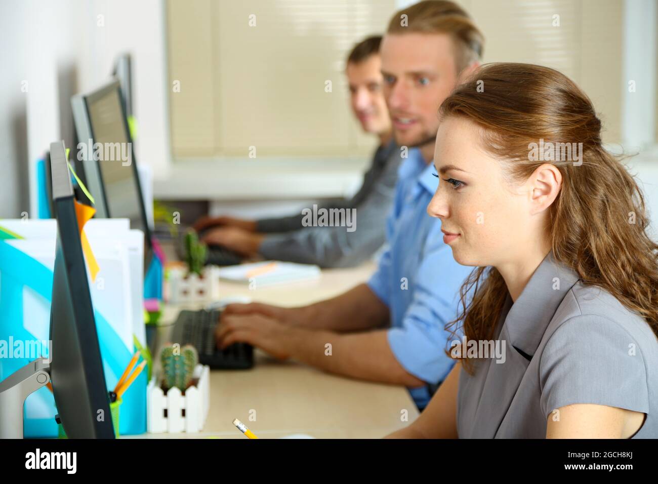 Business people at work place Stock Photo - Alamy