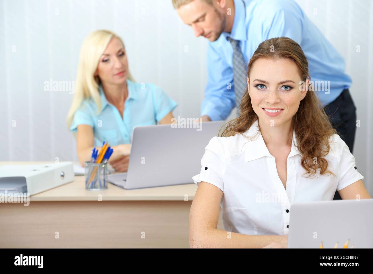 Office workers in workplace Stock Photo - Alamy