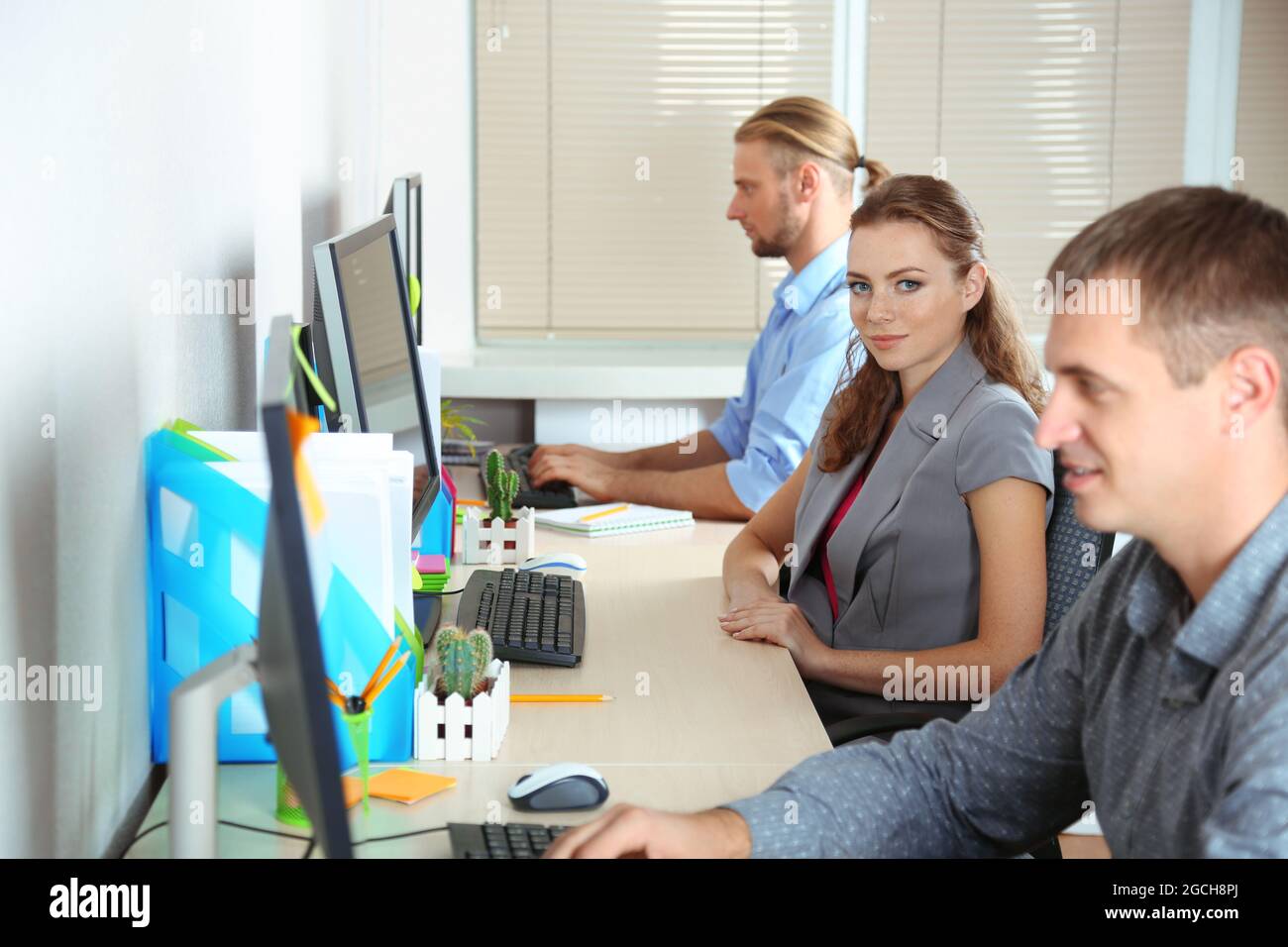Business people at work place Stock Photo - Alamy
