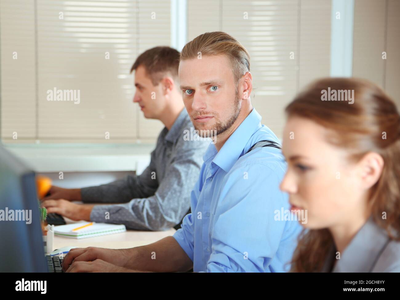 Business people at work place Stock Photo - Alamy