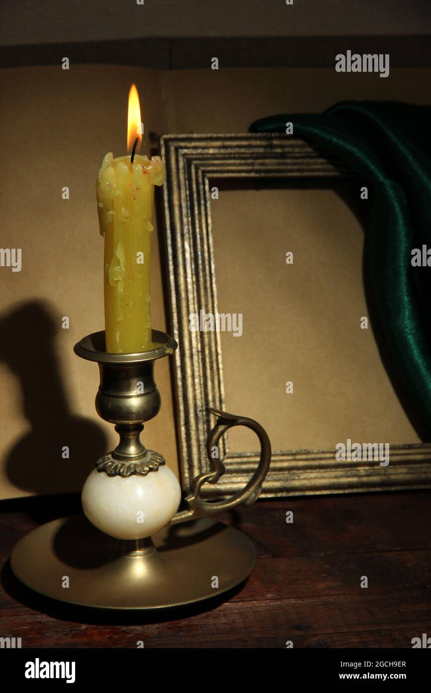 Old candle on table in room Stock Photo - Alamy