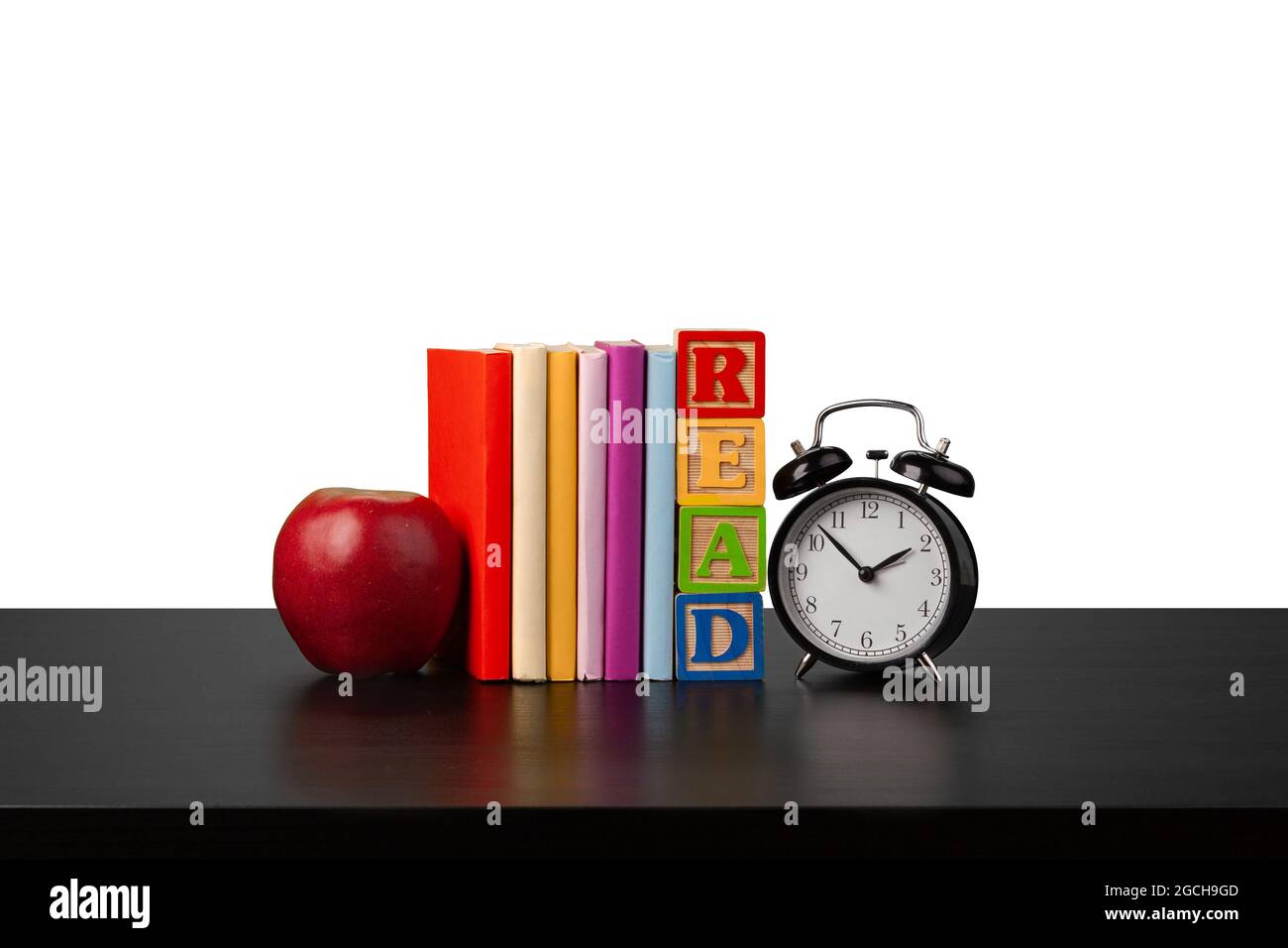 Stack of books and alarm clock, time to read concept Stock Photo - Alamy