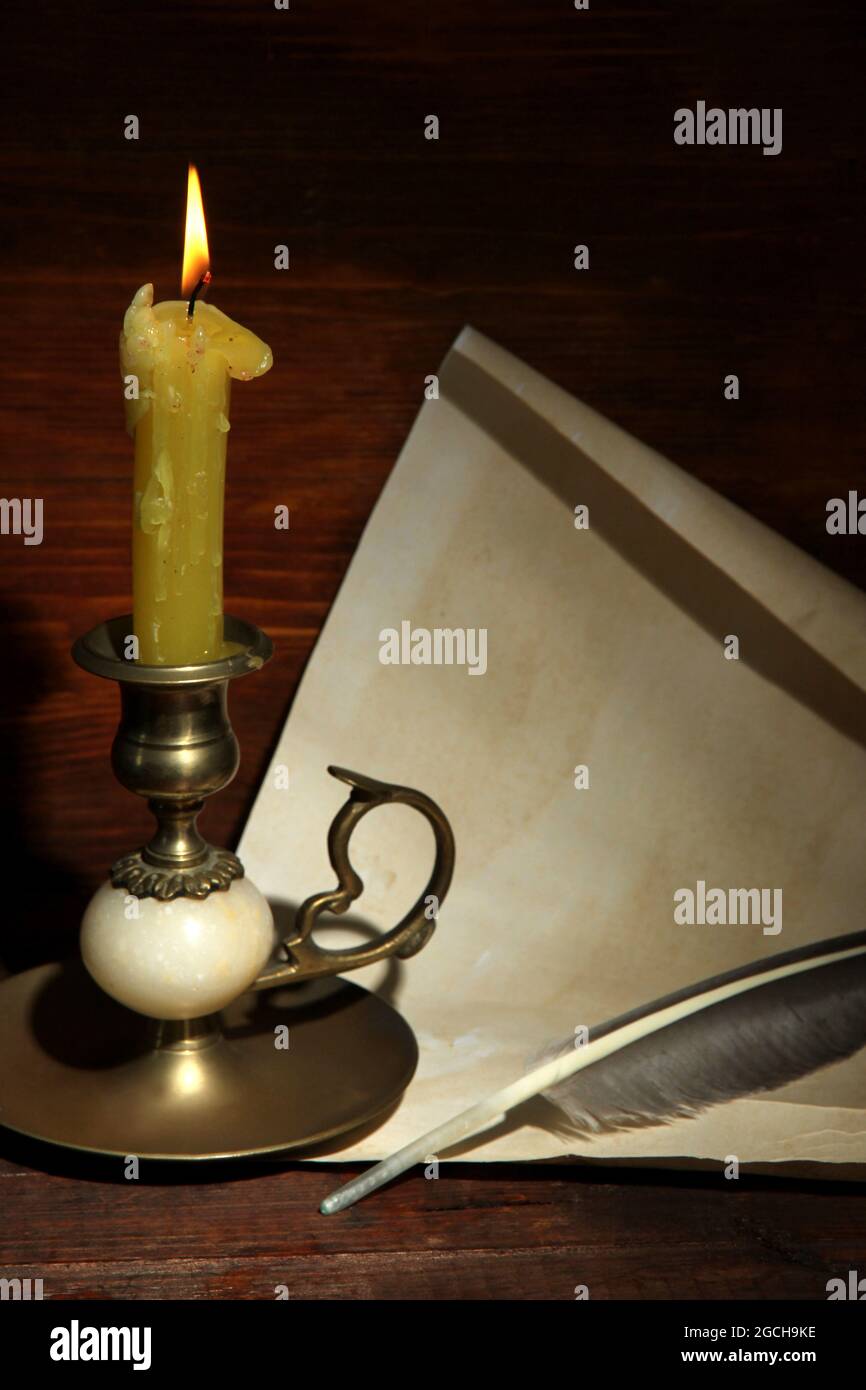 Old candle on table in room Stock Photo - Alamy