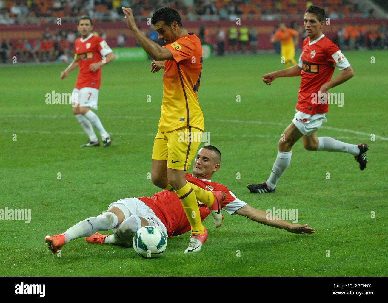 BUCHAREST, ROMANIA - AUGUST 11, 2012: Dragos Grigore of Dinamo slide ...