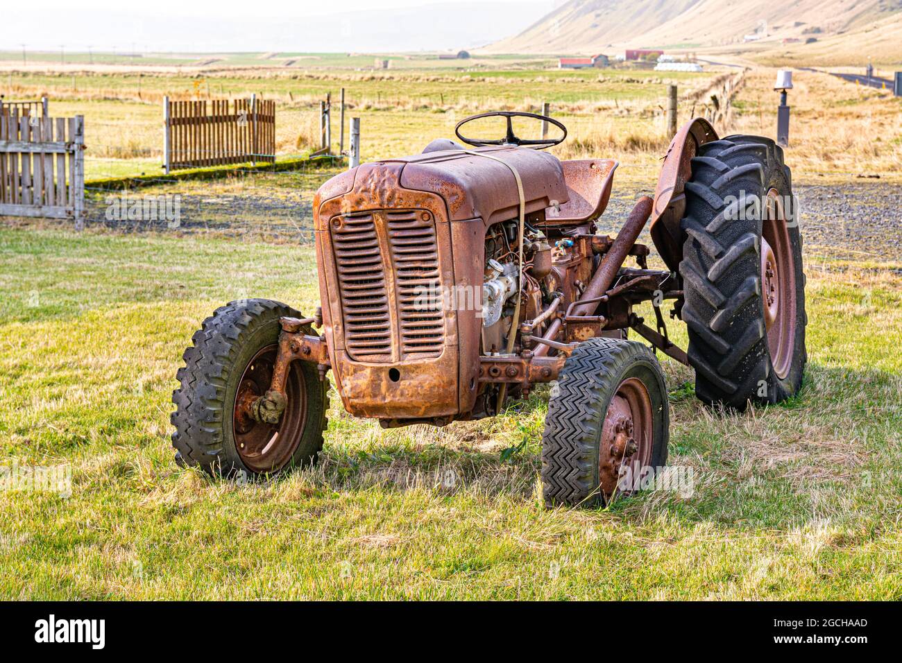 Selective focus of an old and rustic tractor in a ranch Stock Photo - Alamy