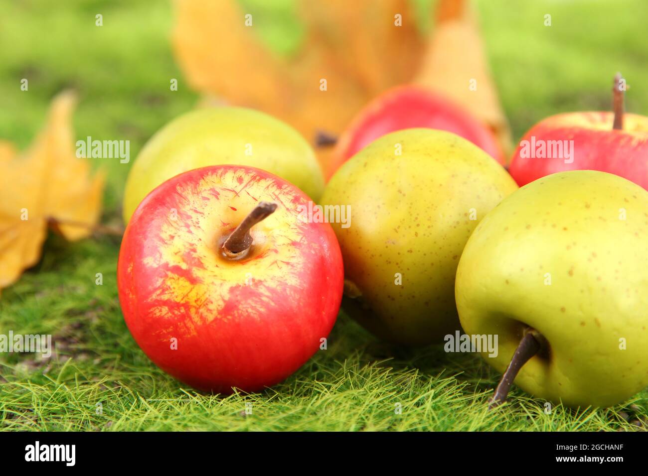 Small apples on nature background Stock Photo - Alamy