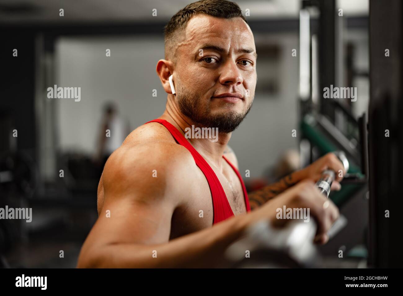 Strong man athlete exercise in gym, close up portrait Stock Photo - Alamy