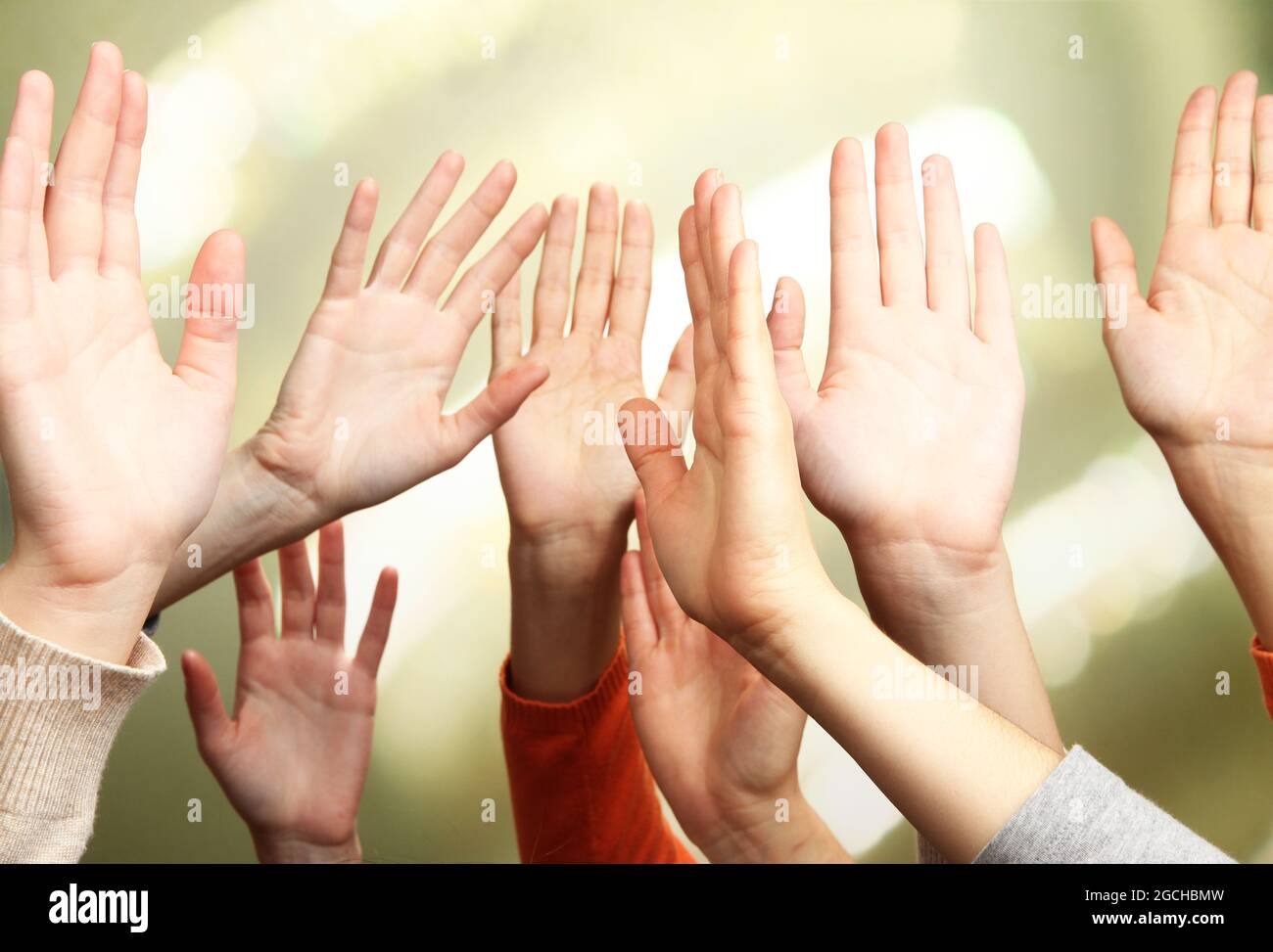 Human hands on bright background Stock Photo - Alamy