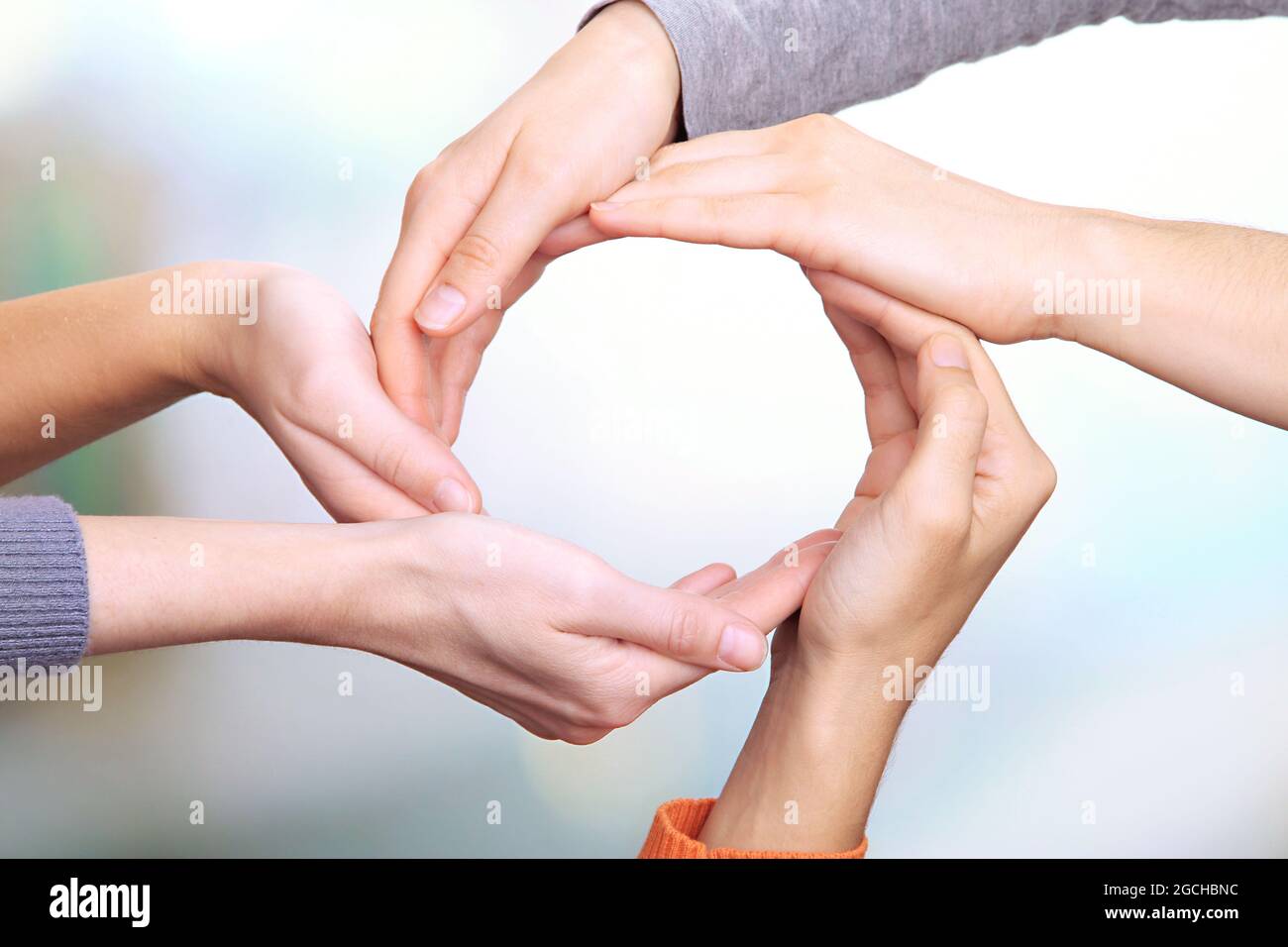 Human hands making circle on bright background Stock Photo - Alamy