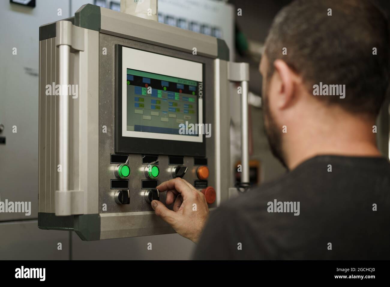 Closeup industrial machine operator operating hi-res stock photography ...