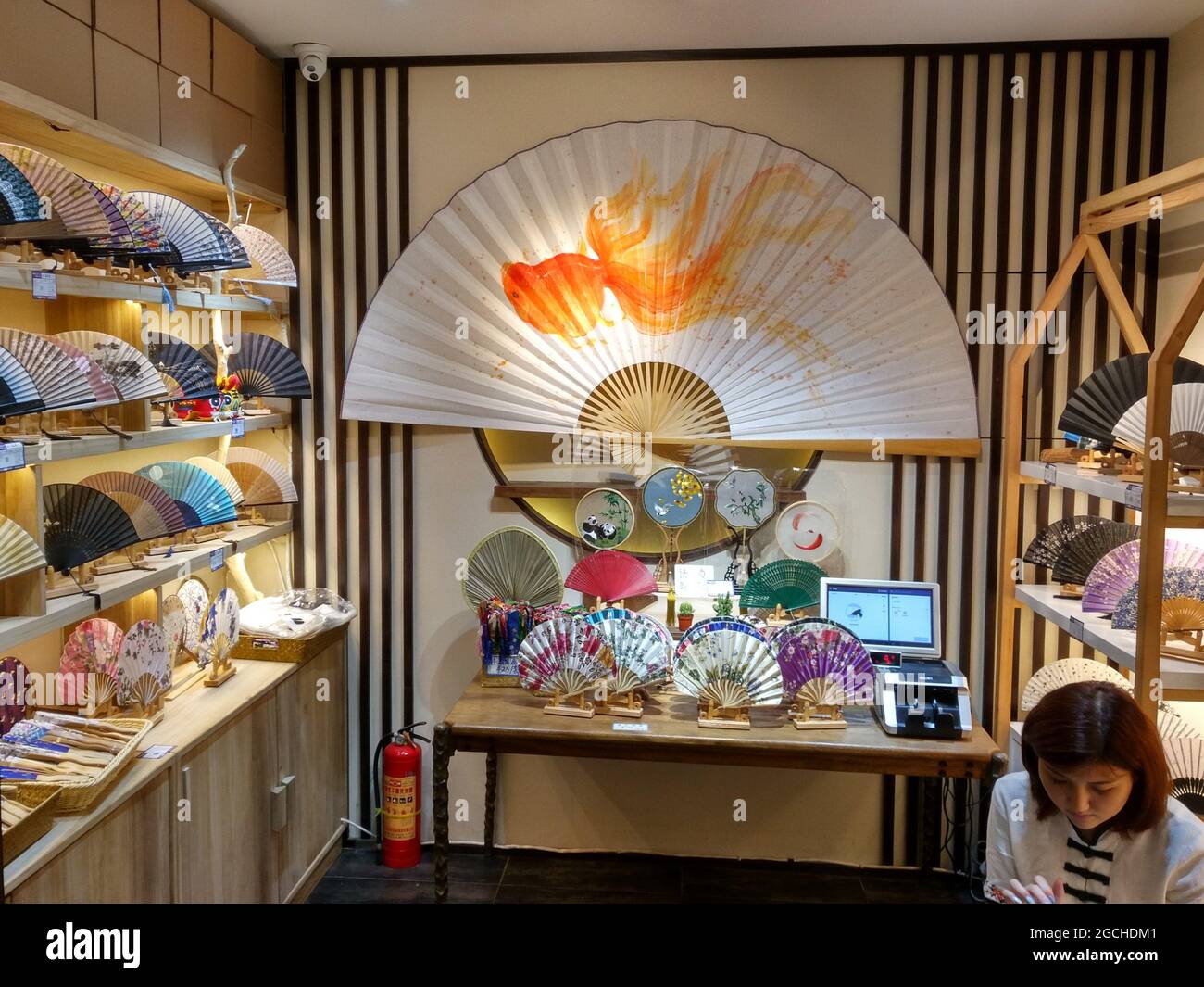 Giant and artistic fans with beautiful designs being sold at a tourist ...