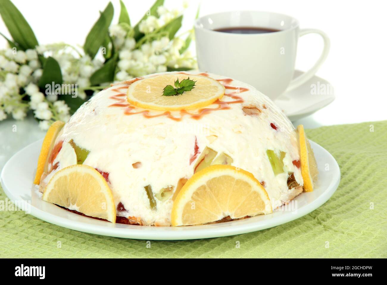 Delicious jelly cake on table on white background Stock Photo - Alamy