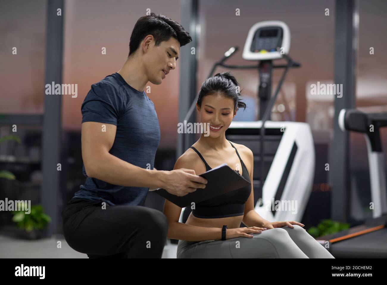 Young asian fitness instructor talking hi-res stock photography and ...