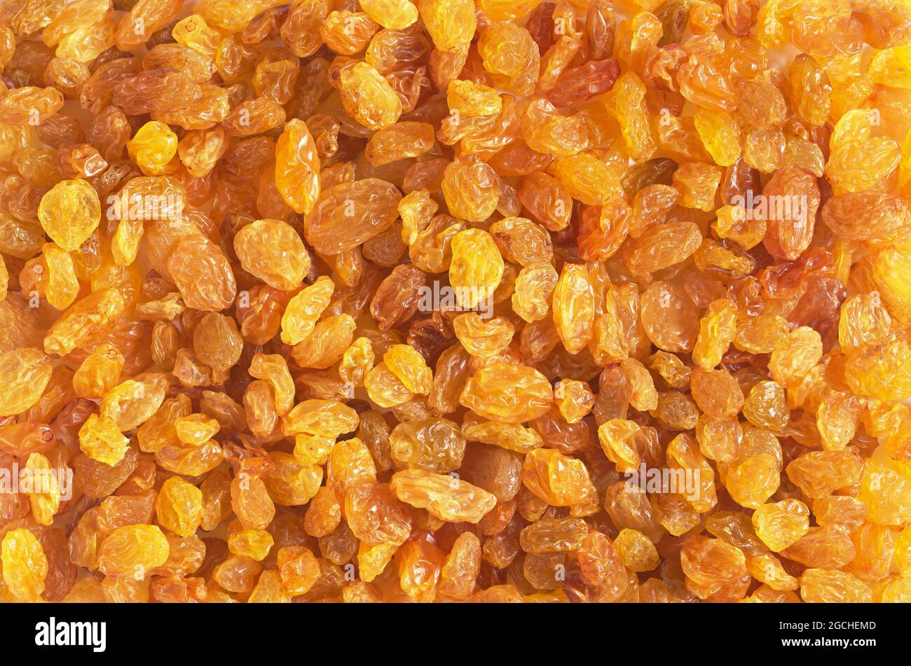 Background with golden raisins. Food texture. Top view Stock Photo - Alamy