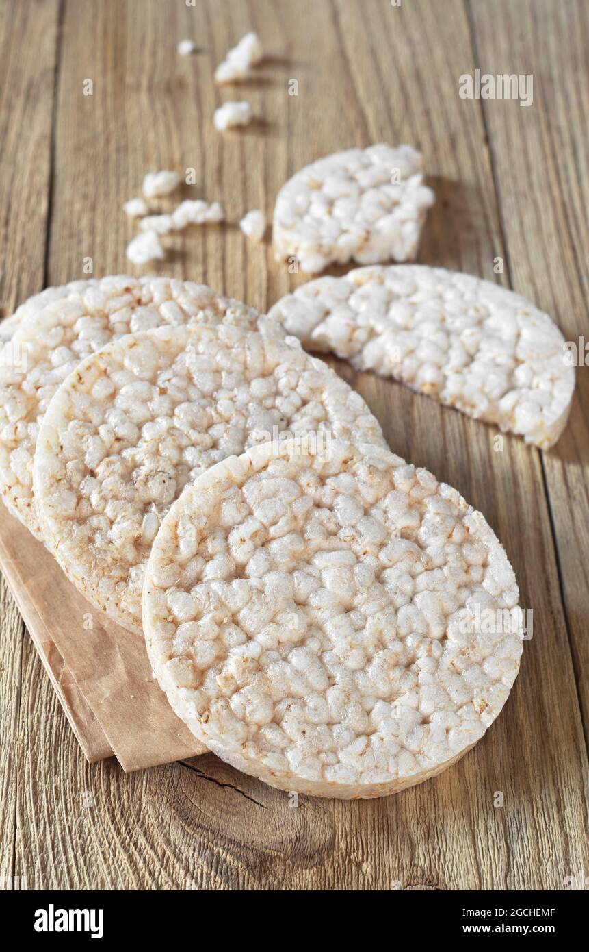 Rice cakes in wicker plate on wooden background. Dietary food with ...