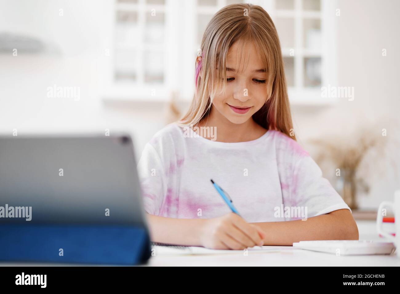 Homeschooled little young girl student having online class using ...