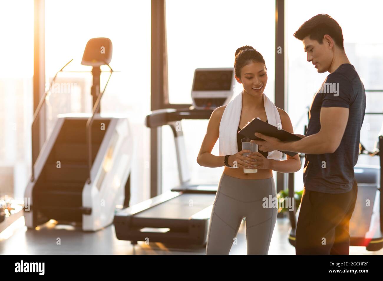 Woman talking personal trainer hi-res stock photography and images - Alamy