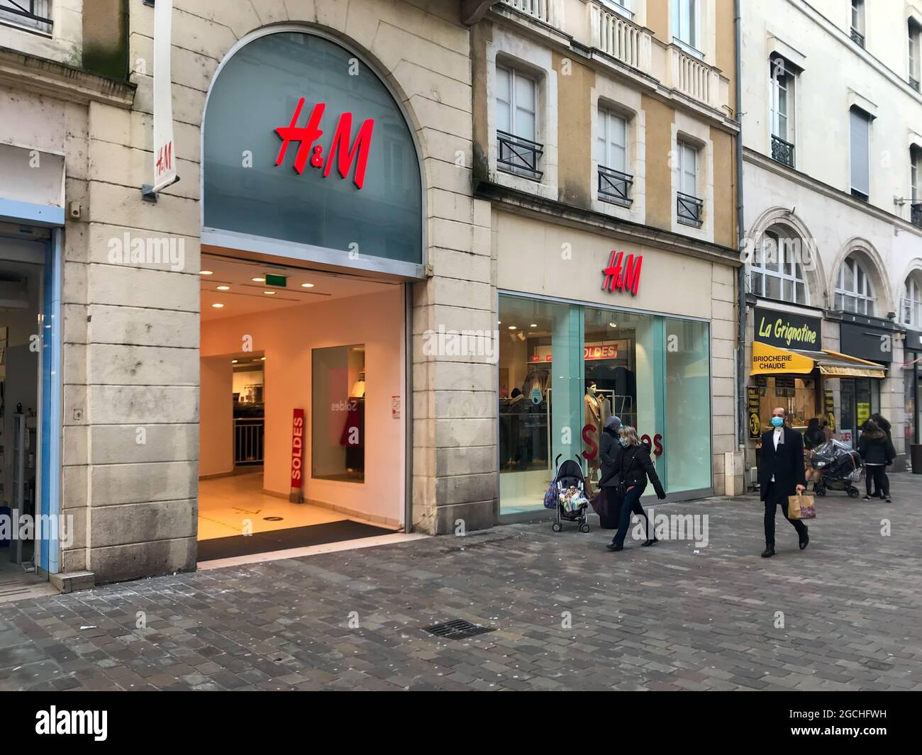LA FLECHE, FRANCE - Jul 21, 2021: A view of d front store facade of HM ...