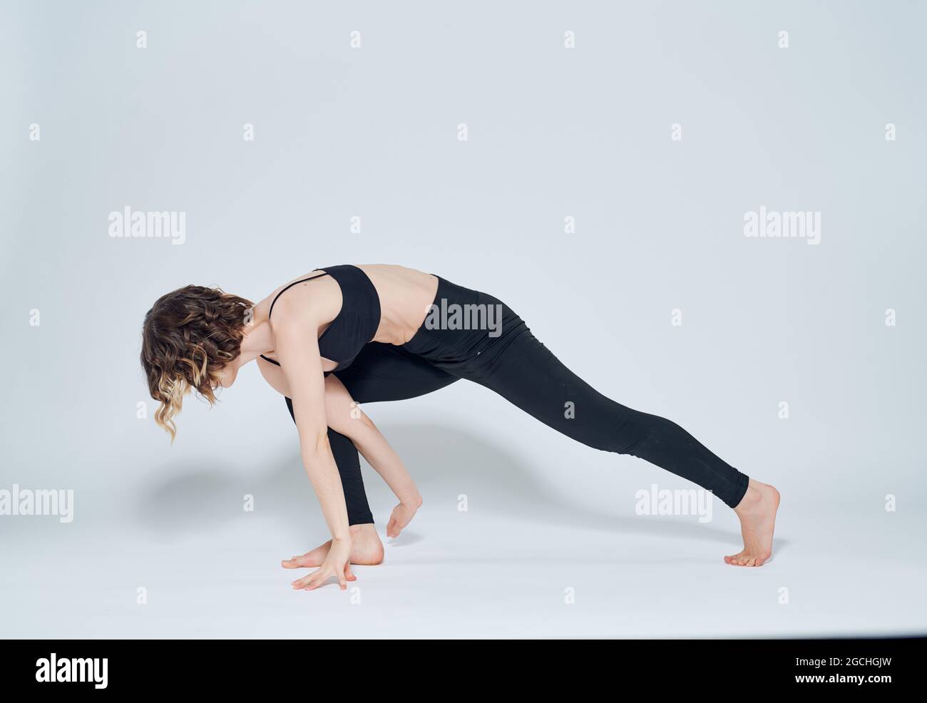 woman gymnast workout stretch isolated background Stock Photo - Alamy
