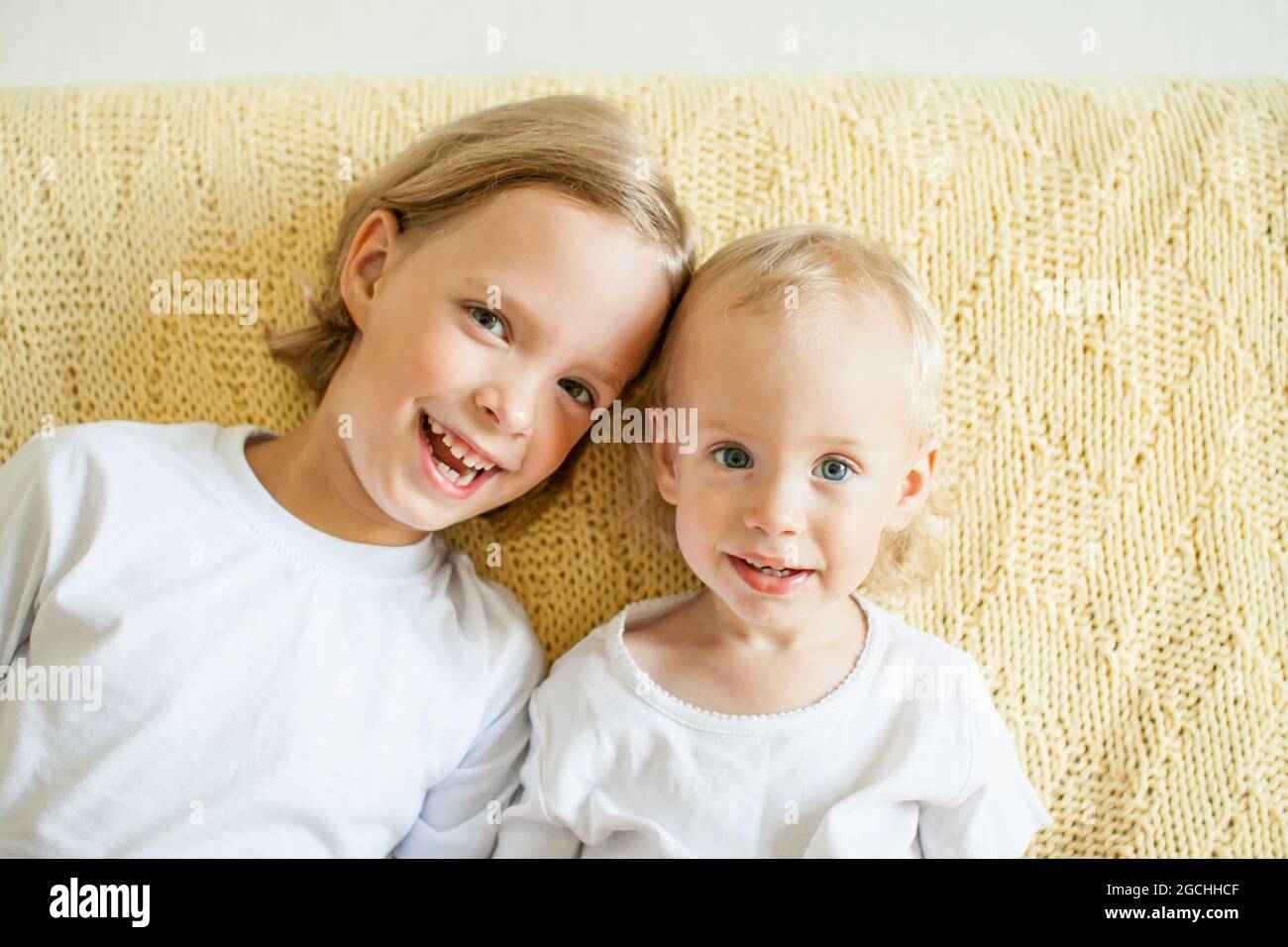 Portrait of two joyful happy sisters Stock Photo - Alamy