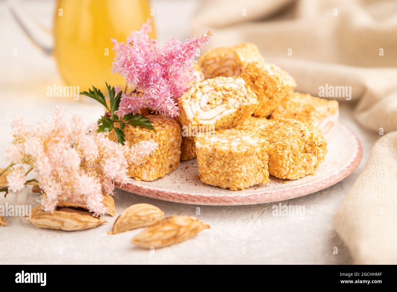 Traditional turkish delight (rahat lokum) with glass of green tea on a ...