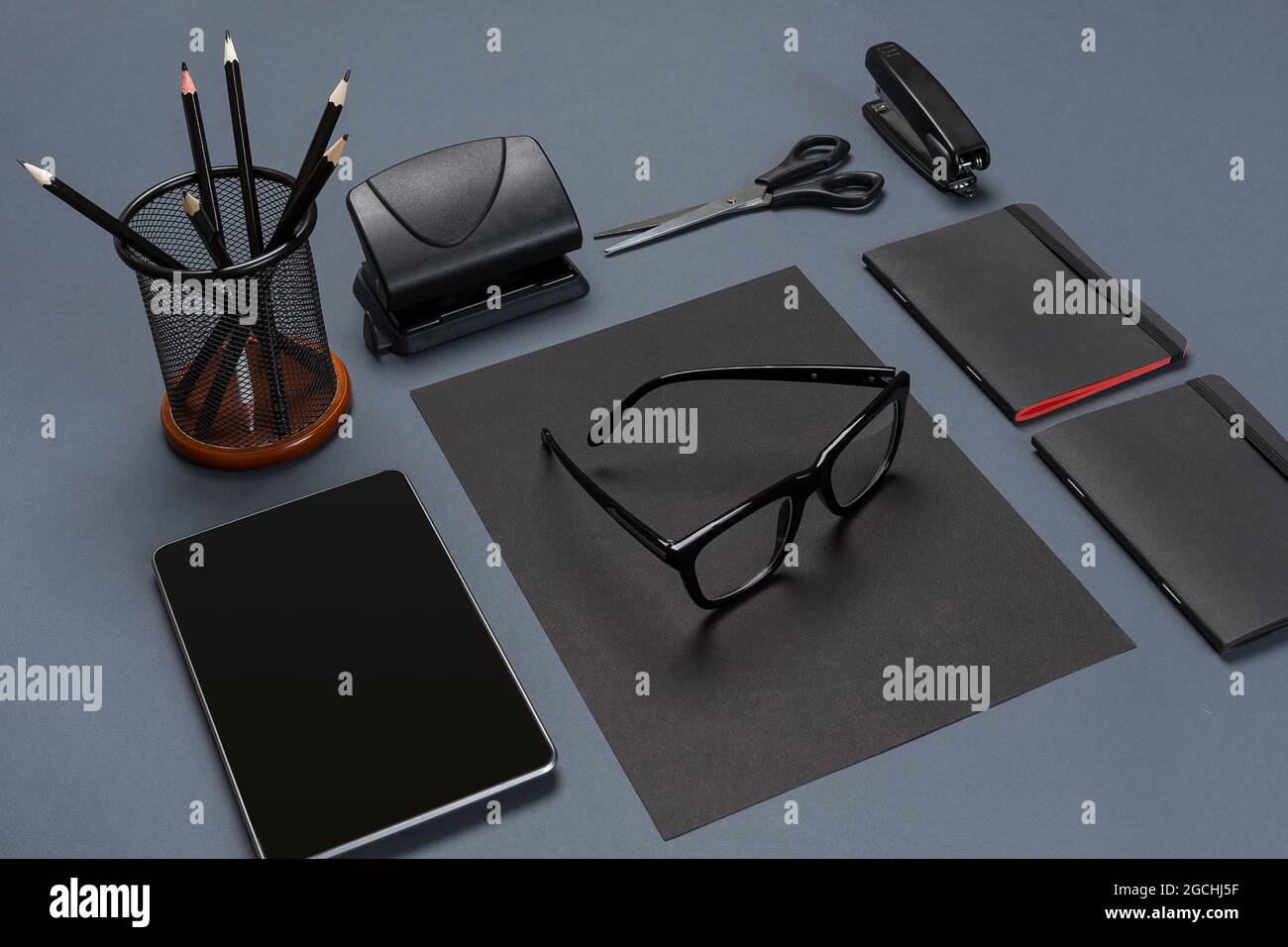 Black office stuff collection flat lay. Top view on set of stationery ...