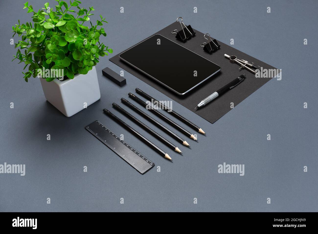 Modern mock up flat lay of notebook and stationery on gray background ...