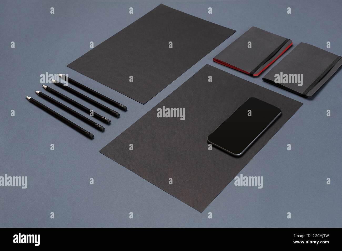 Modern mock up flat lay of notebook and stationery on gray background ...
