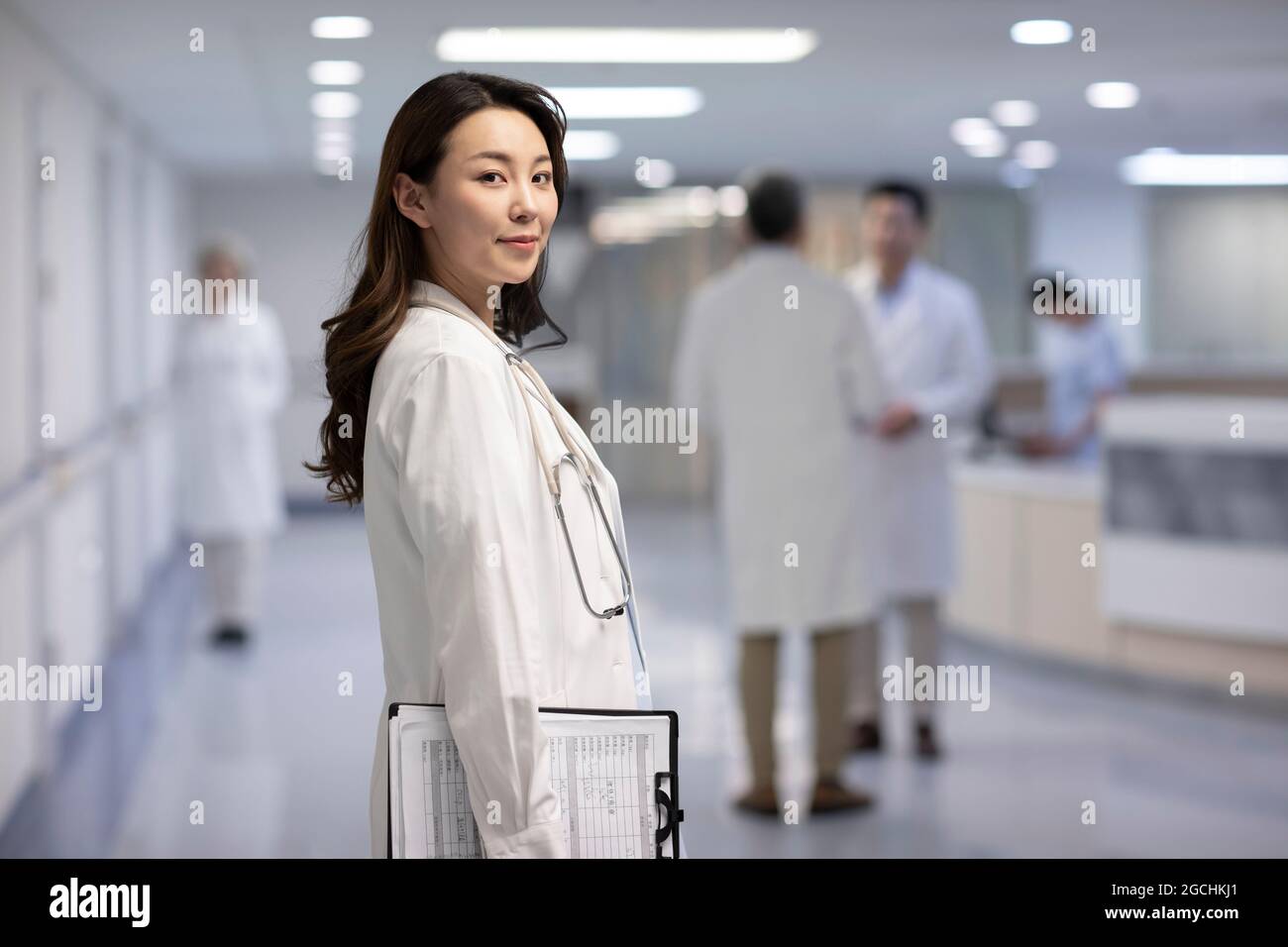 Young asian doctor talking camera hi-res stock photography and images ...