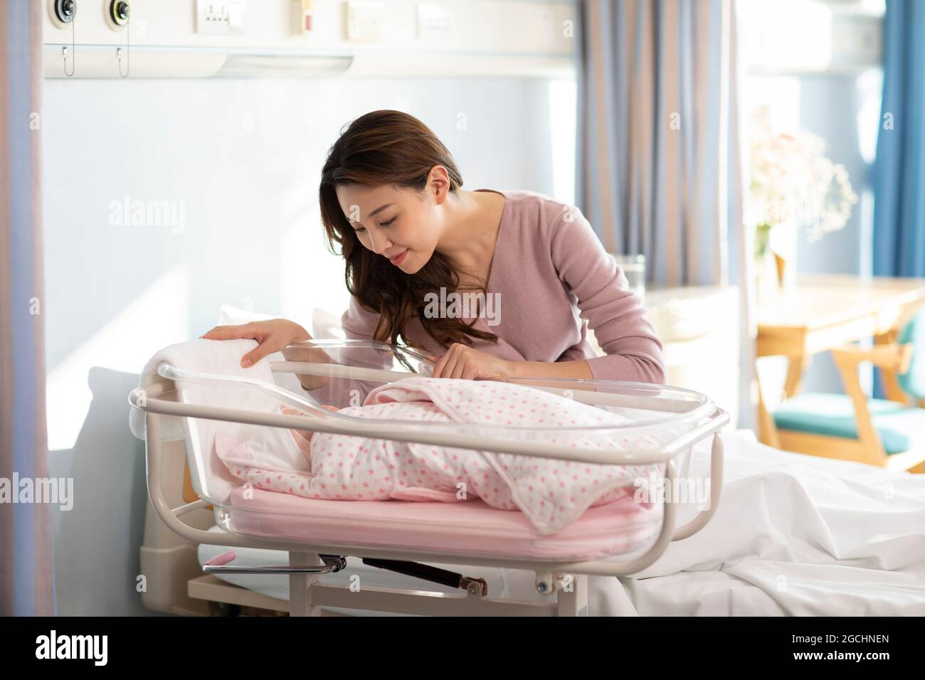 Young mother with newborn baby in hospital ward Stock Photo - Alamy