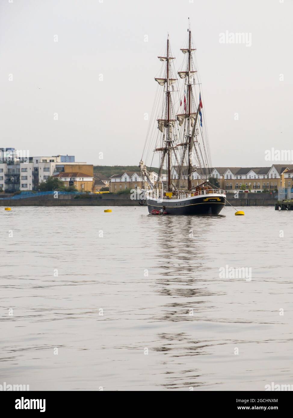 A single sail ship in the Thames Estuary at Silvertown, UK Stock Photo ...