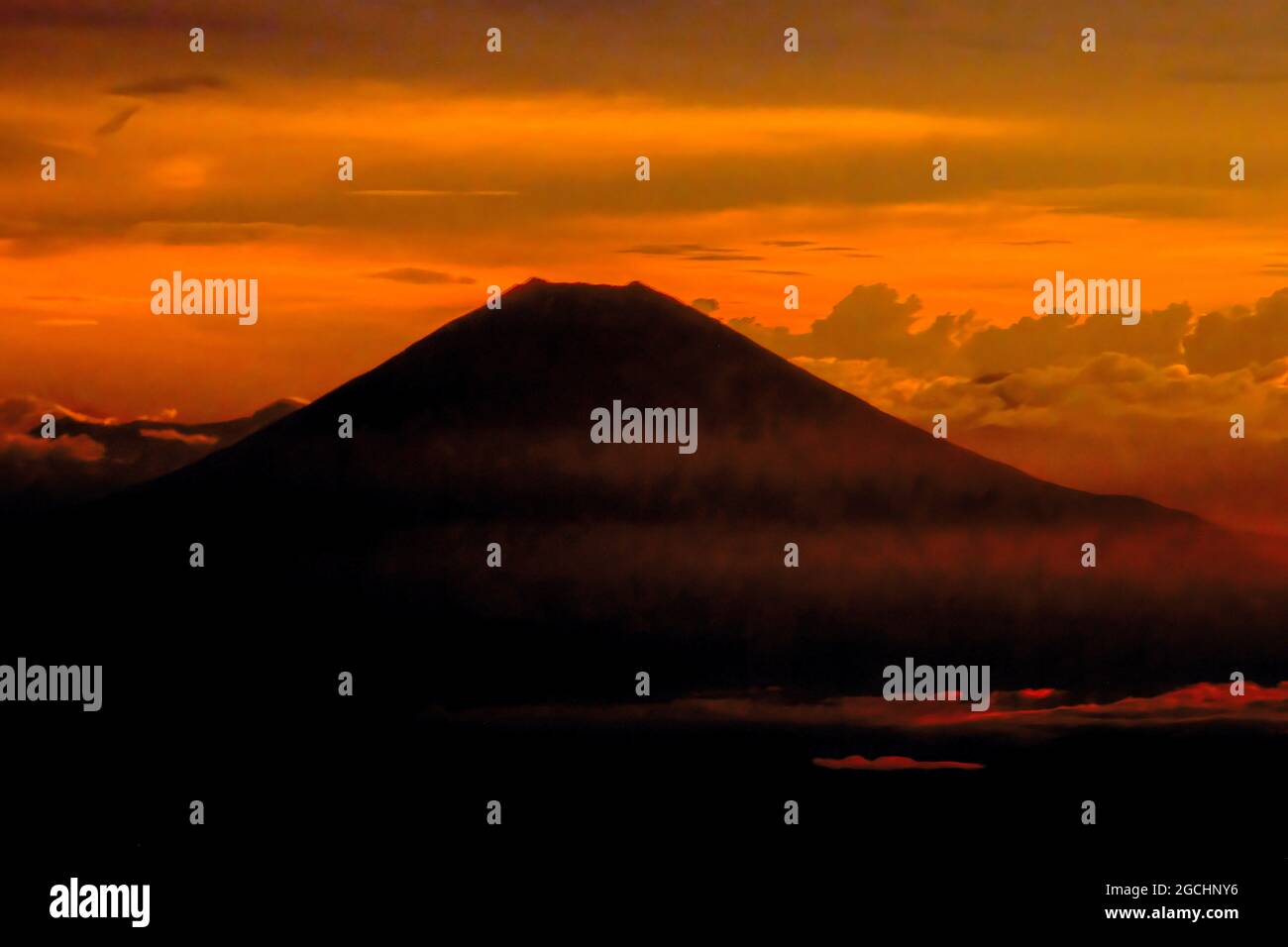 Tokyo, Japan. 16th July, 2021. The sun setting over Mt. Fuji seen from ...