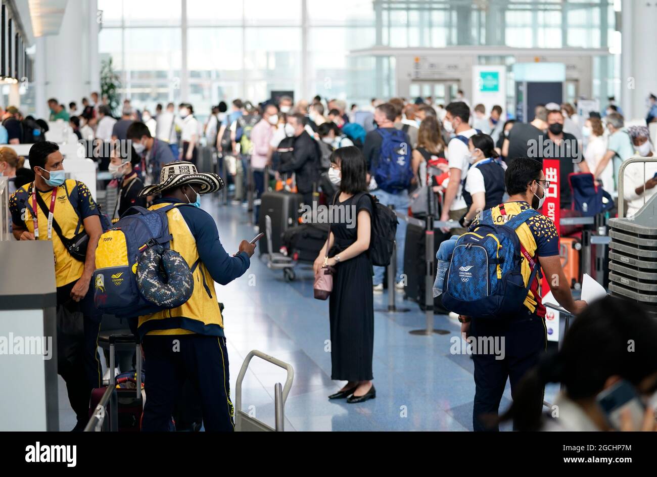 People in the departures area at Haneda Airport following the Tokyo ...