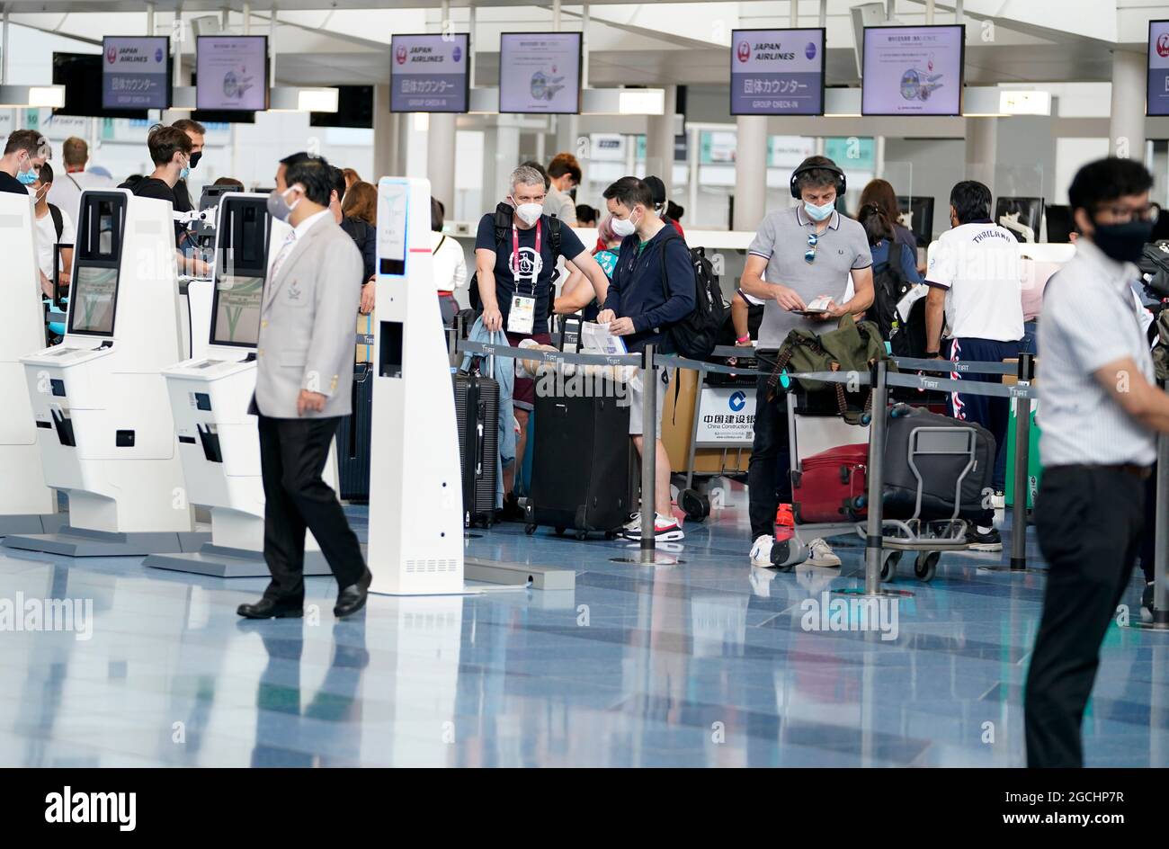 People in the departures area at Haneda Airport following the Tokyo ...