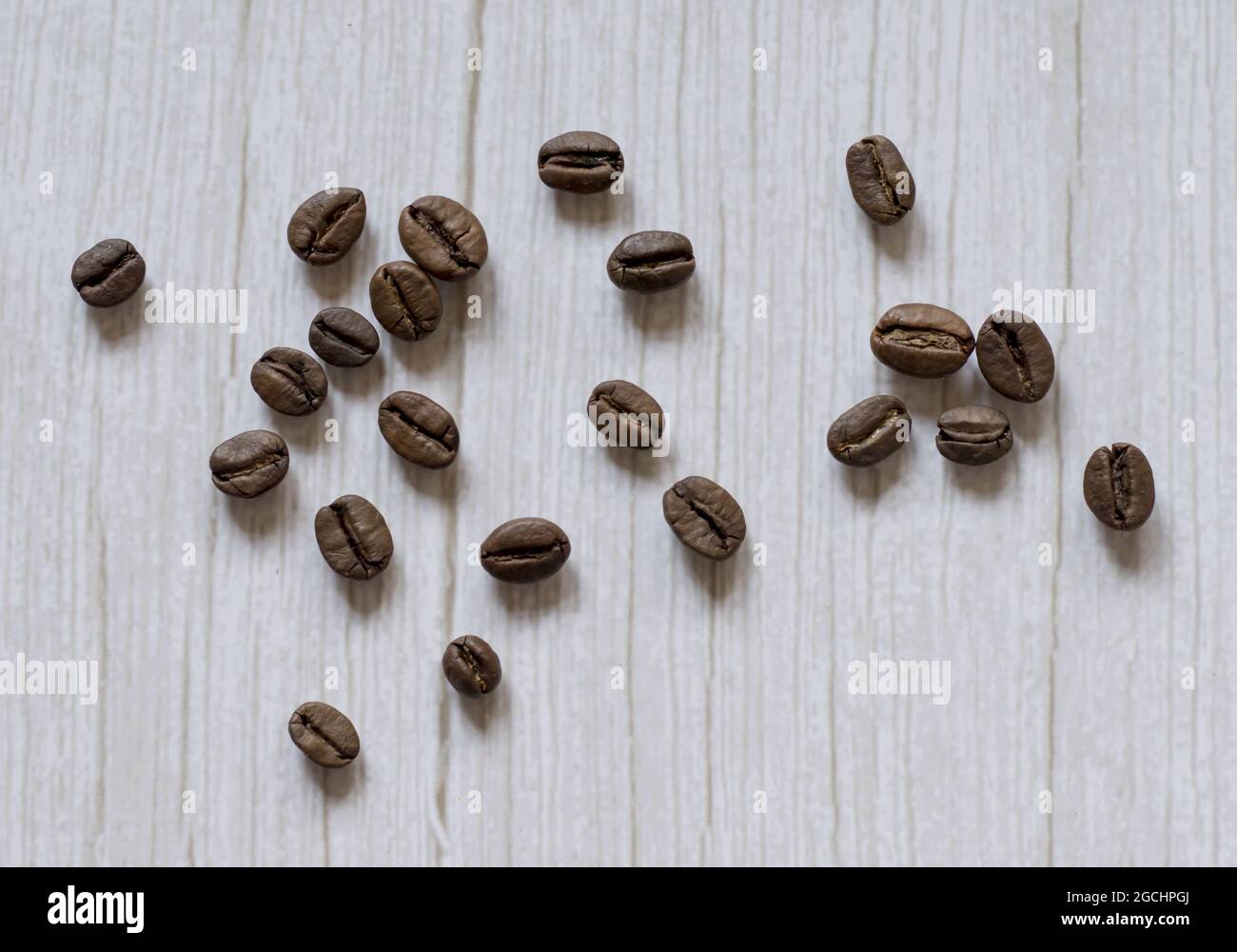 Top view of coffee beans on a wooden surface Stock Photo - Alamy