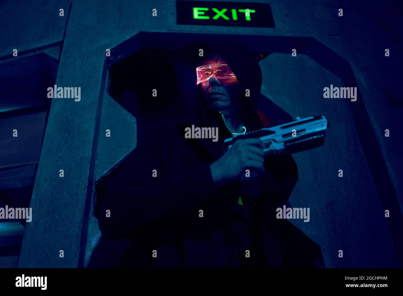 Man with blaster in the futuristic battle. Concept virtual reality ...