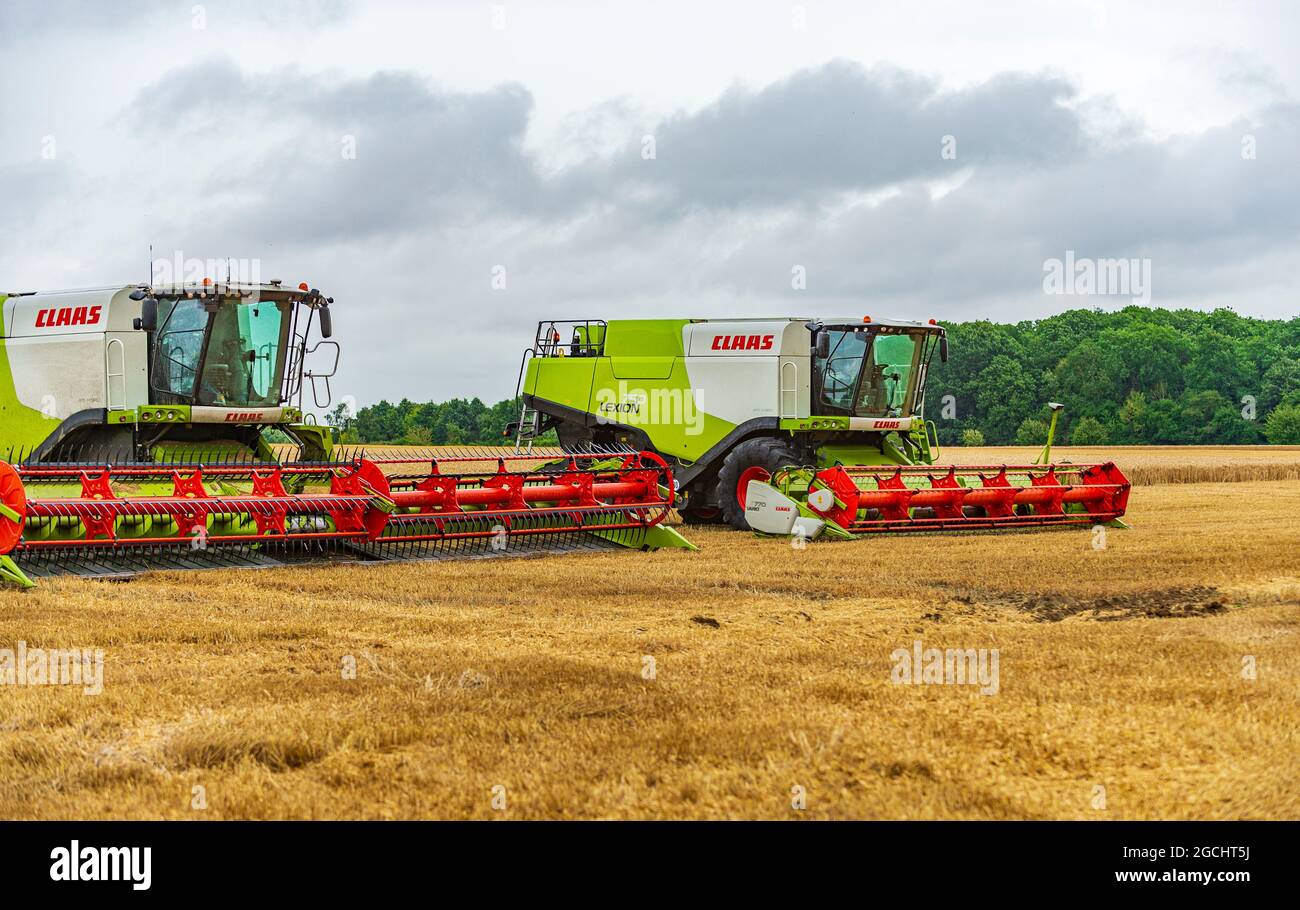 Class 750 Lexion combine harvesters parked up on a stubble field ...