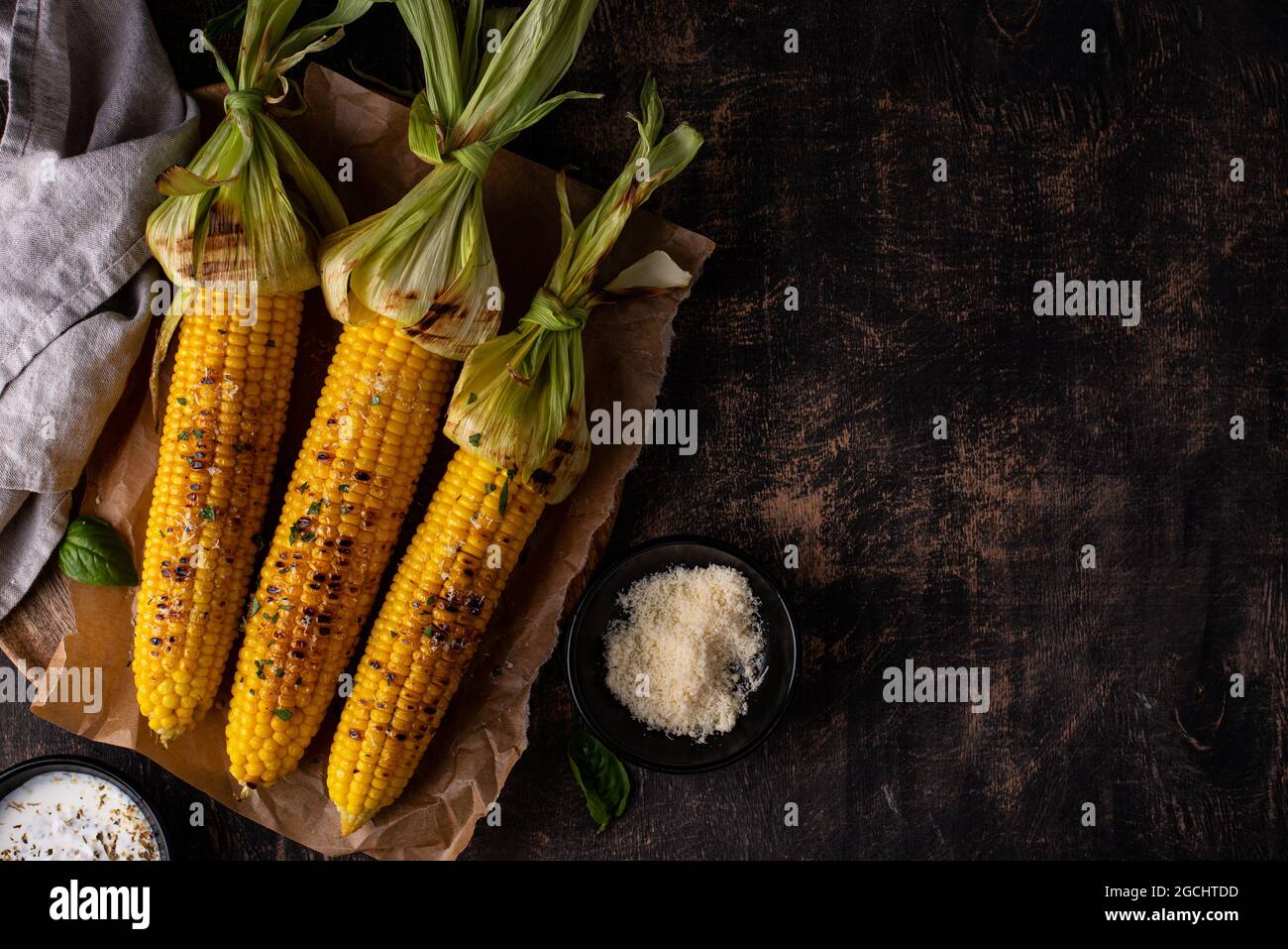 Grilled corn cobs with parmesan cheese Stock Photo - Alamy