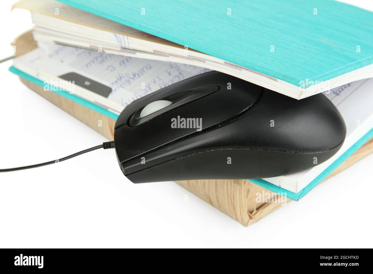 Computer mouse on books isolated on white Stock Photo - Alamy