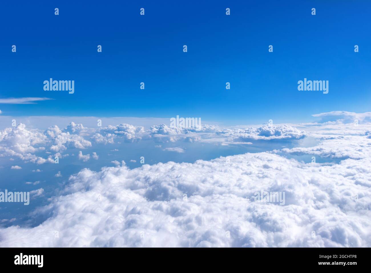 Beautiful cumulus fluffy white clouds on a blue sky with bright sun ...