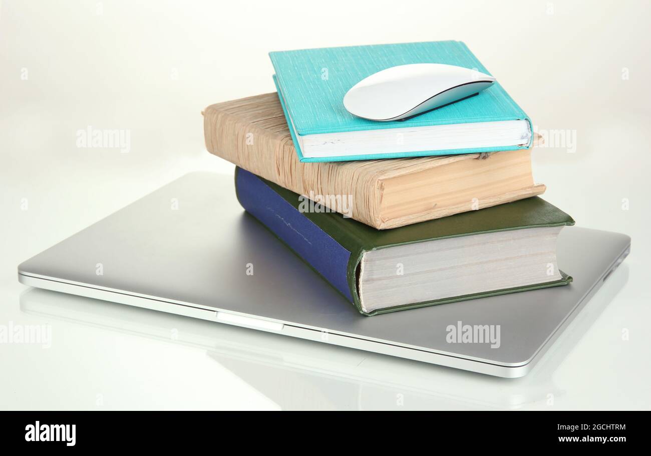 Computer mouse on books and notebook isolated on white Stock Photo - Alamy