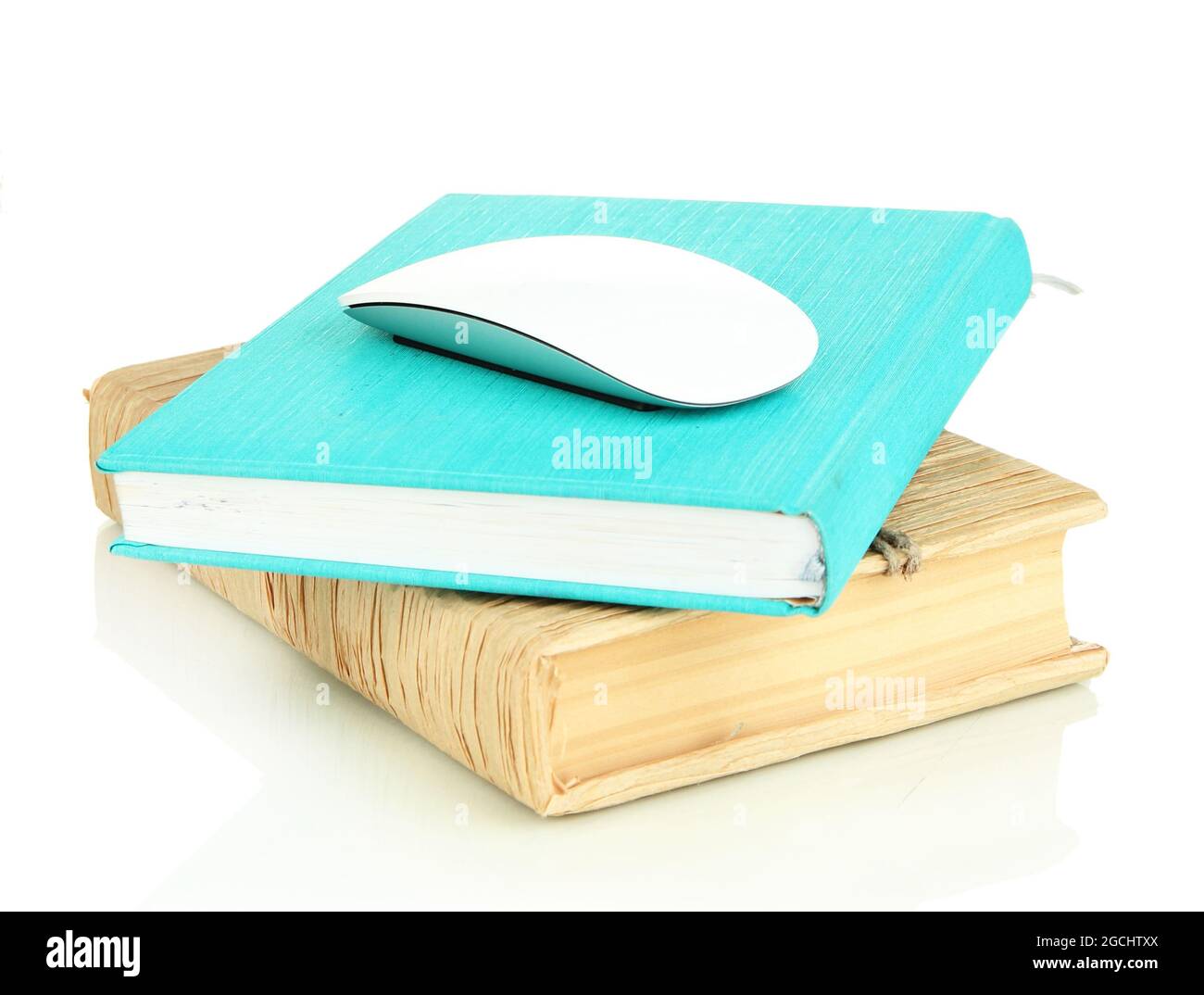 Computer mouse on books isolated on white Stock Photo - Alamy